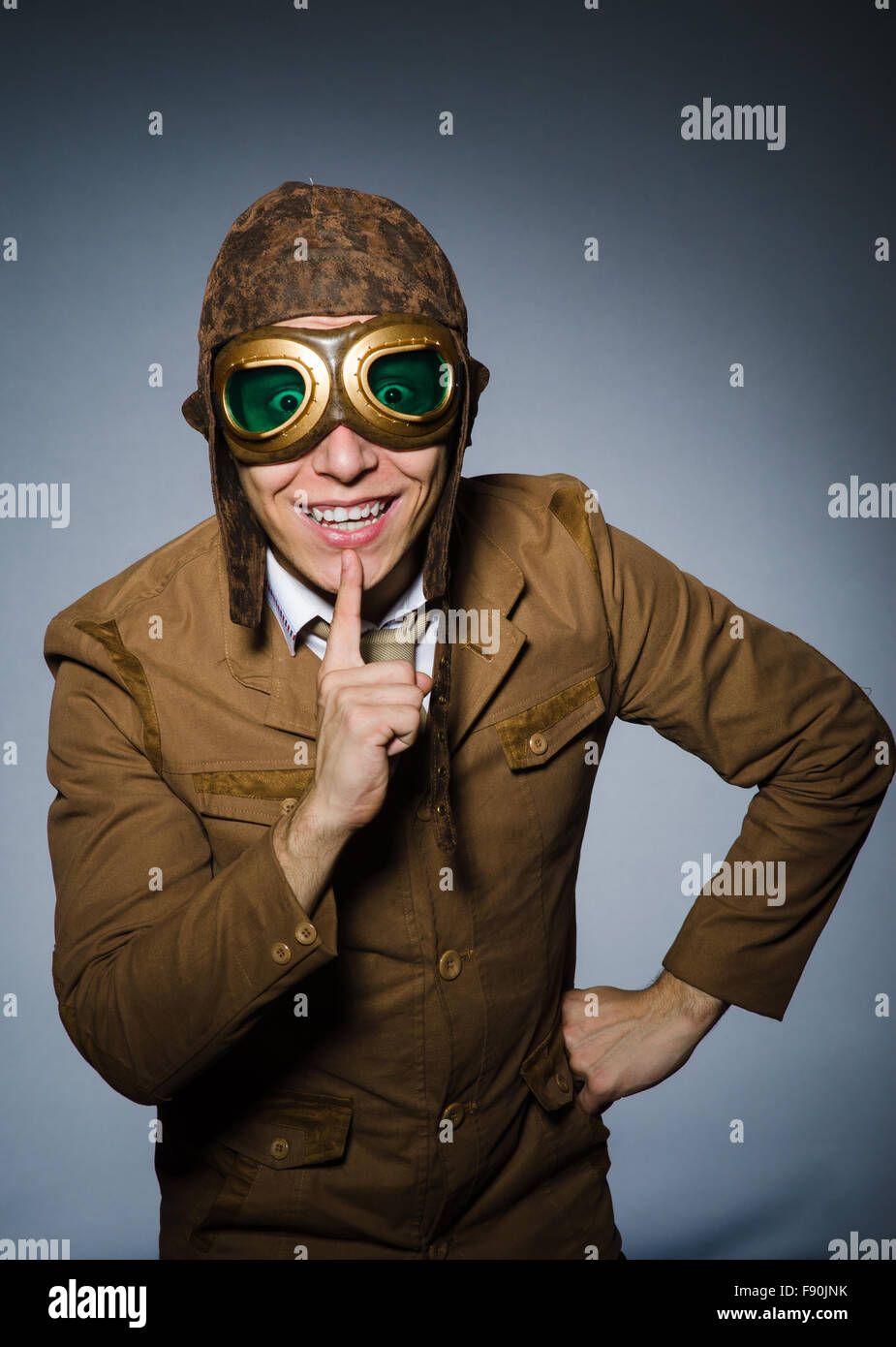 Funny pilot with goggles and helmet Stock Photo - Alamy