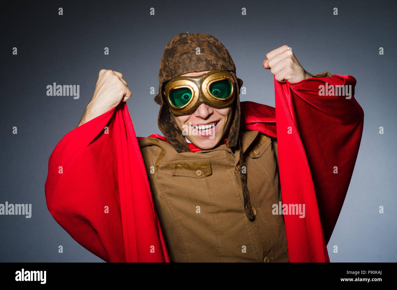 Funny pilot with goggles and helmet Stock Photo - Alamy