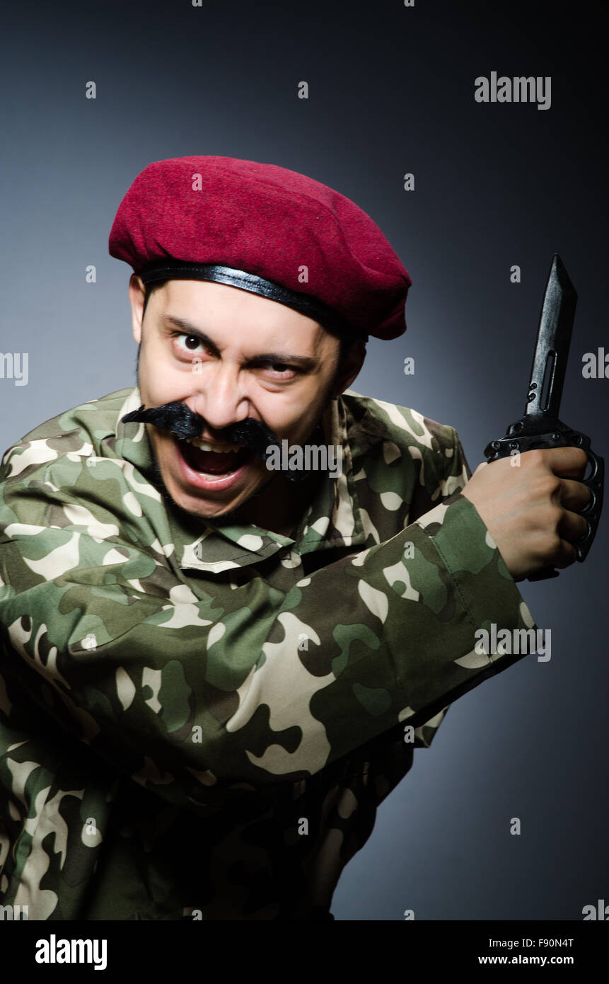 Funny soldier against the dark background Stock Photo - Alamy