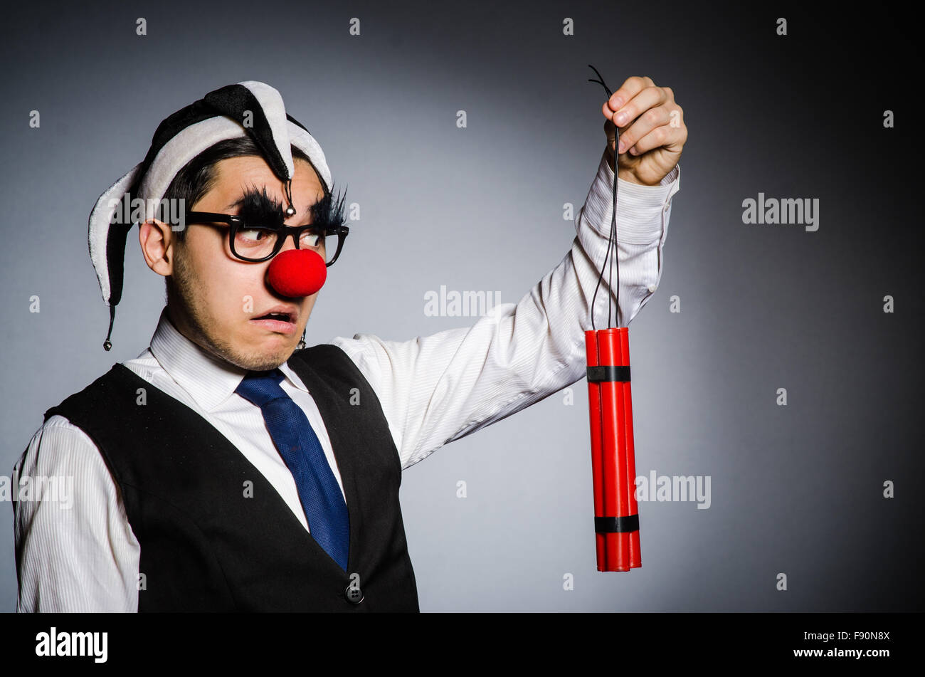 Funny clown with sticks of dynamite Stock Photo - Alamy