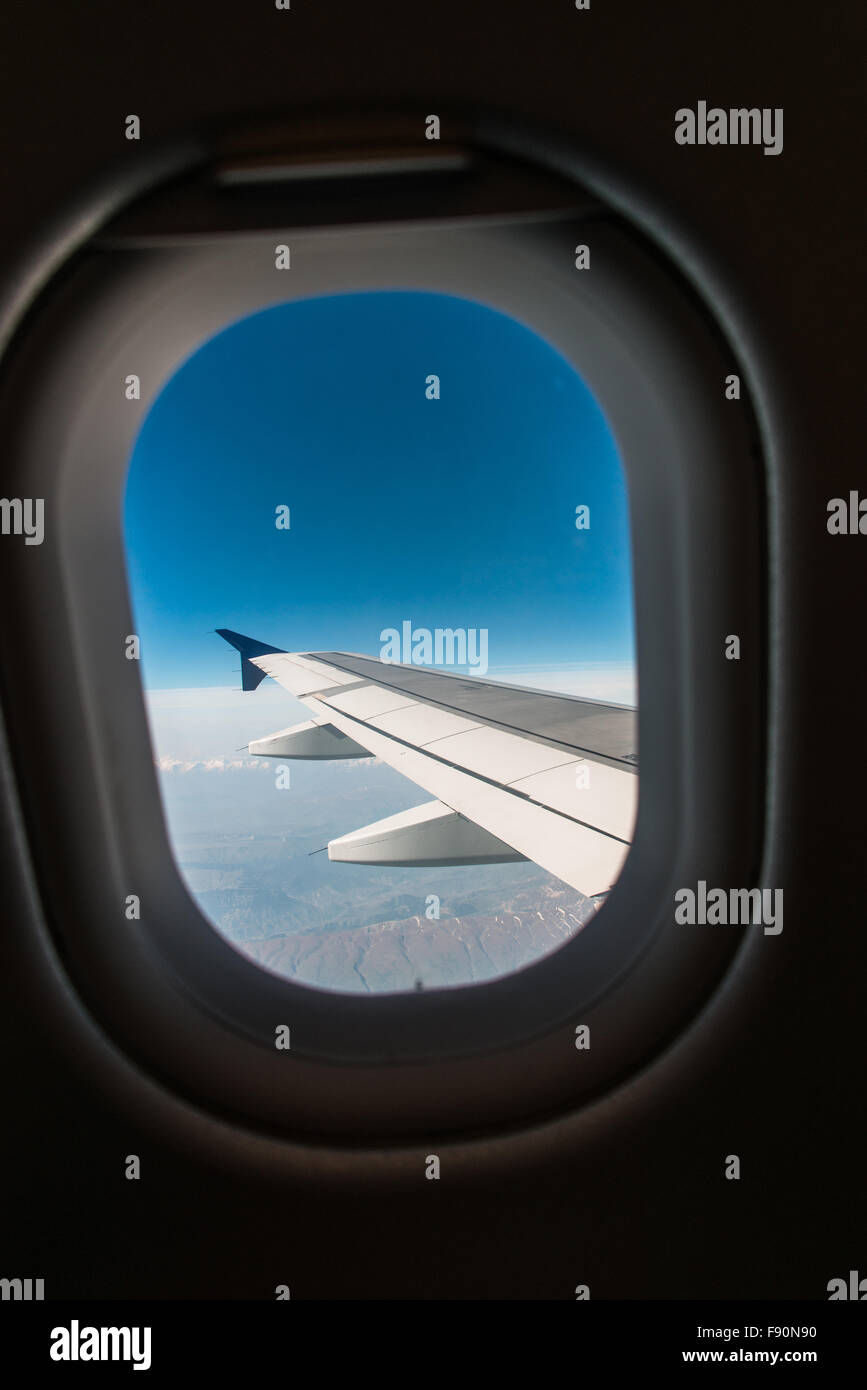 Airplane wing out of window Stock Photo - Alamy