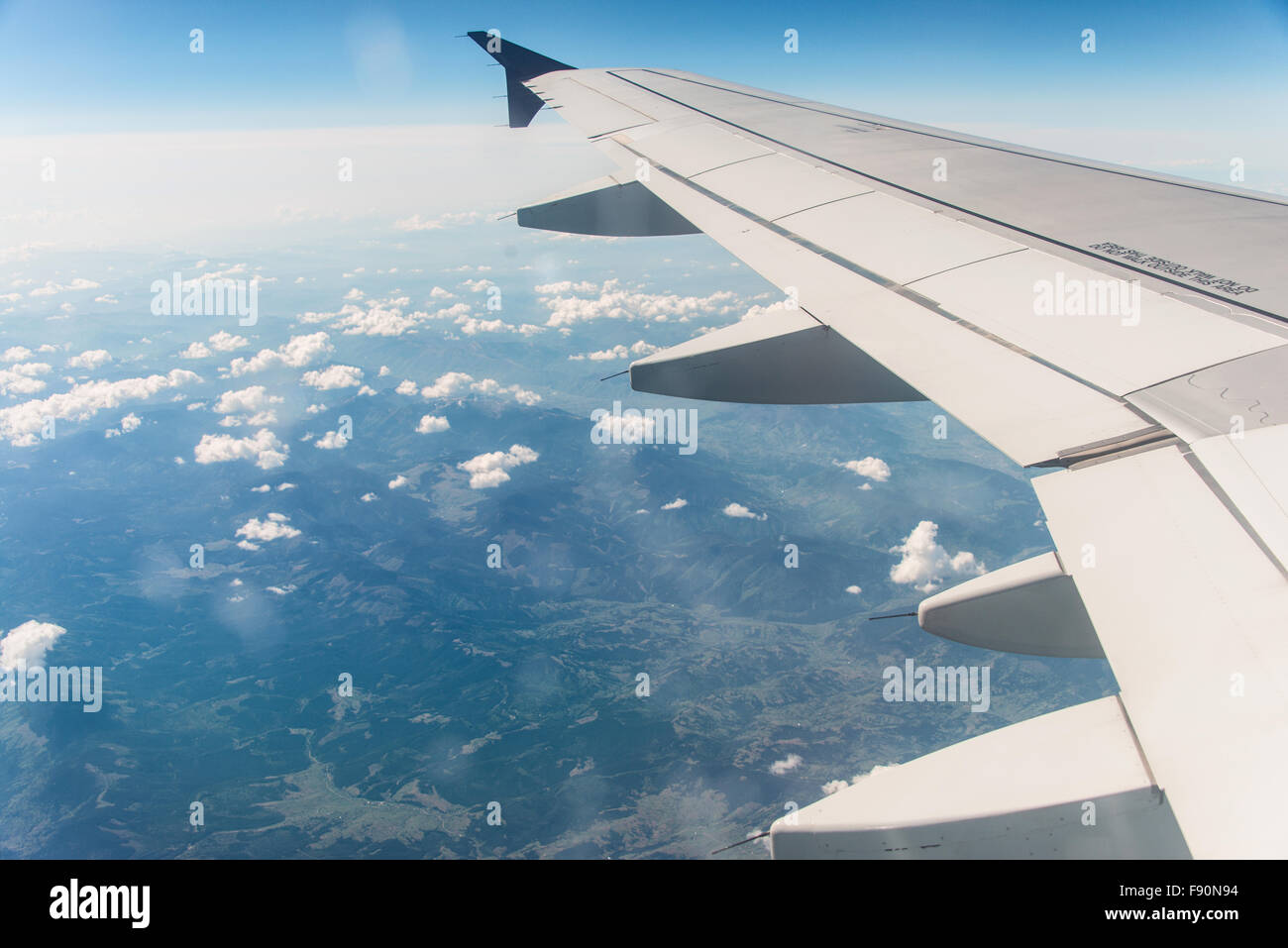 Airplane wing out of window Stock Photo - Alamy