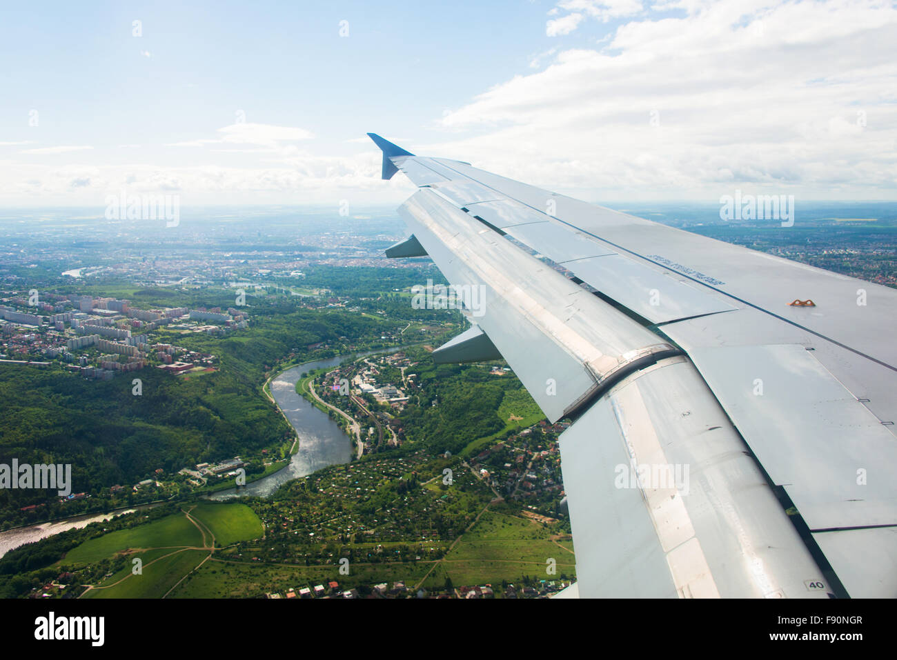 Airplane wing out of window Stock Photo - Alamy