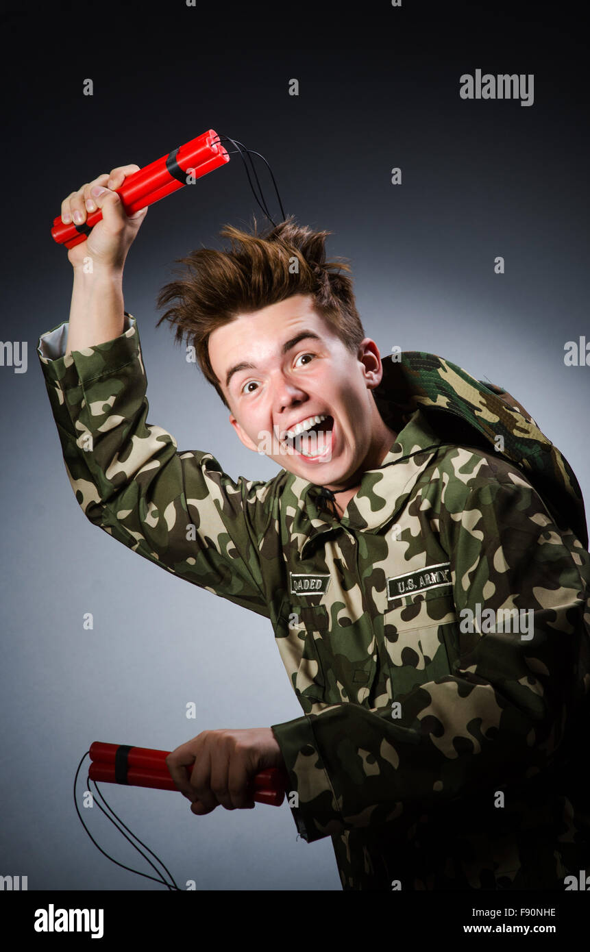 Funny soldier with red dynamite Stock Photo - Alamy