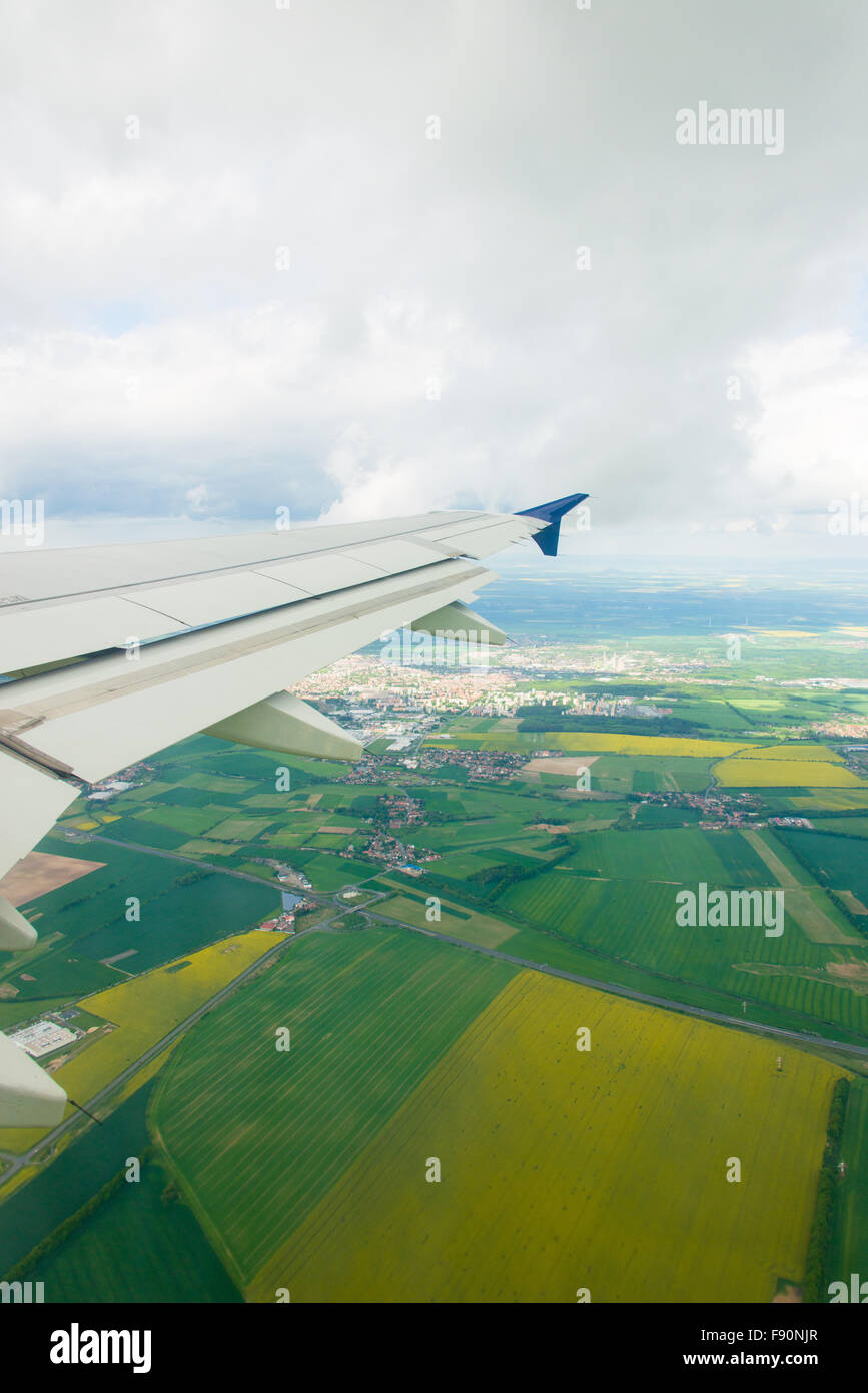 Airplane wing out of window Stock Photo - Alamy
