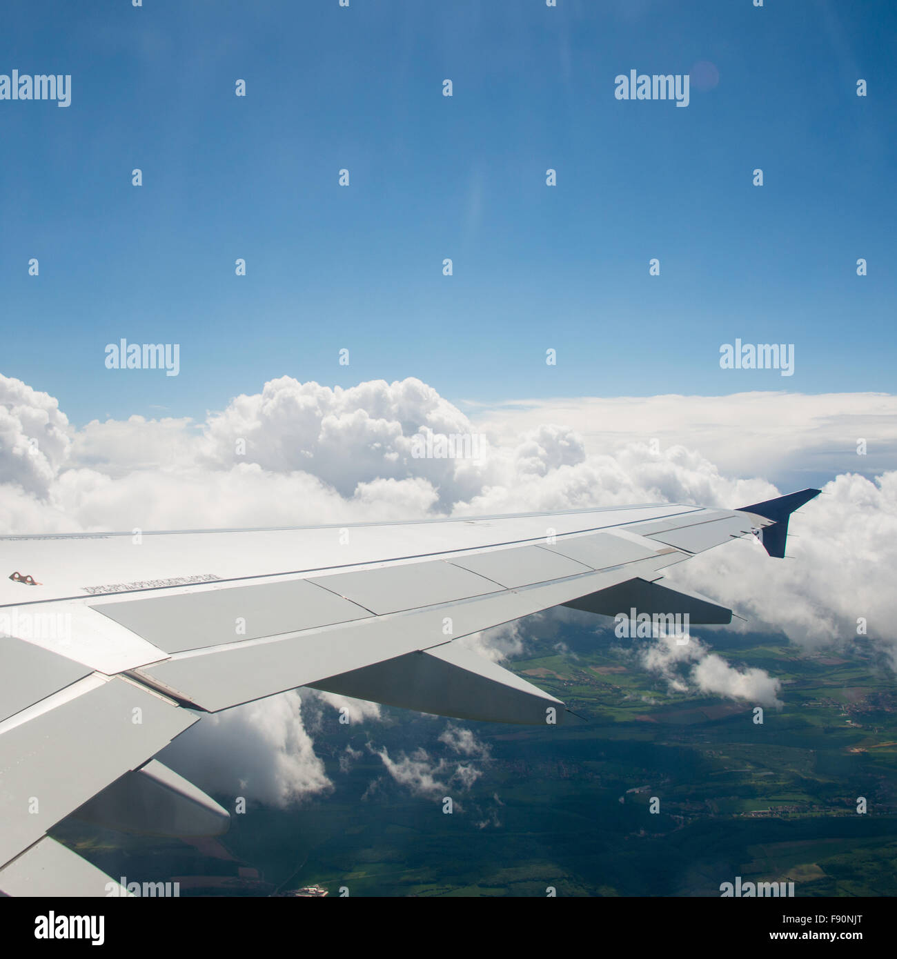 Airplane wing out of window Stock Photo - Alamy