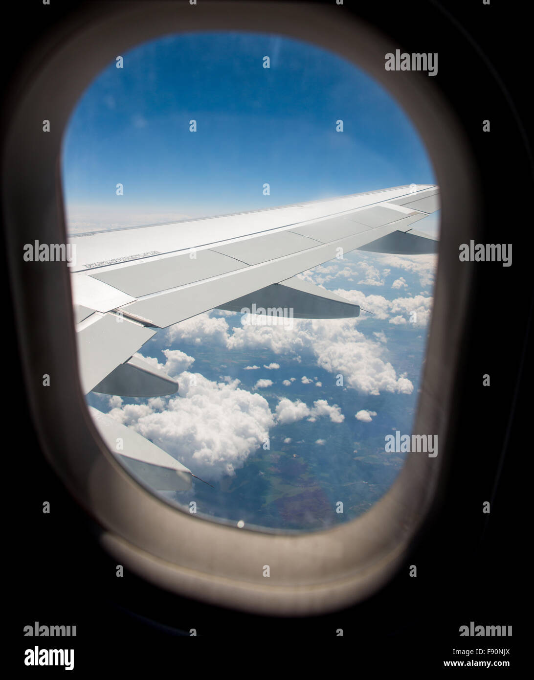 Airplane wing out of window Stock Photo - Alamy