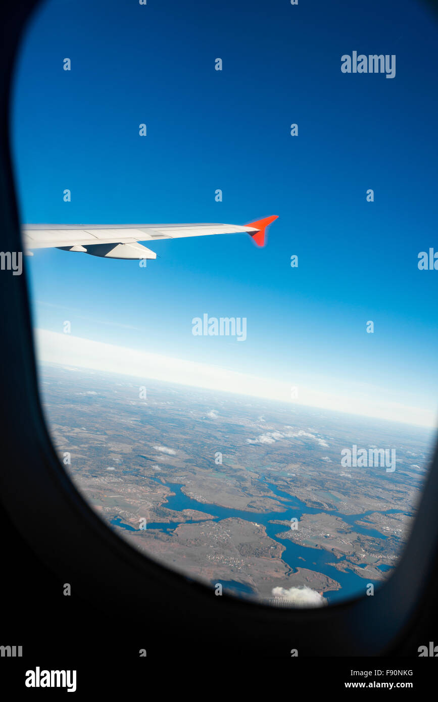 Airplane wing out of window Stock Photo - Alamy