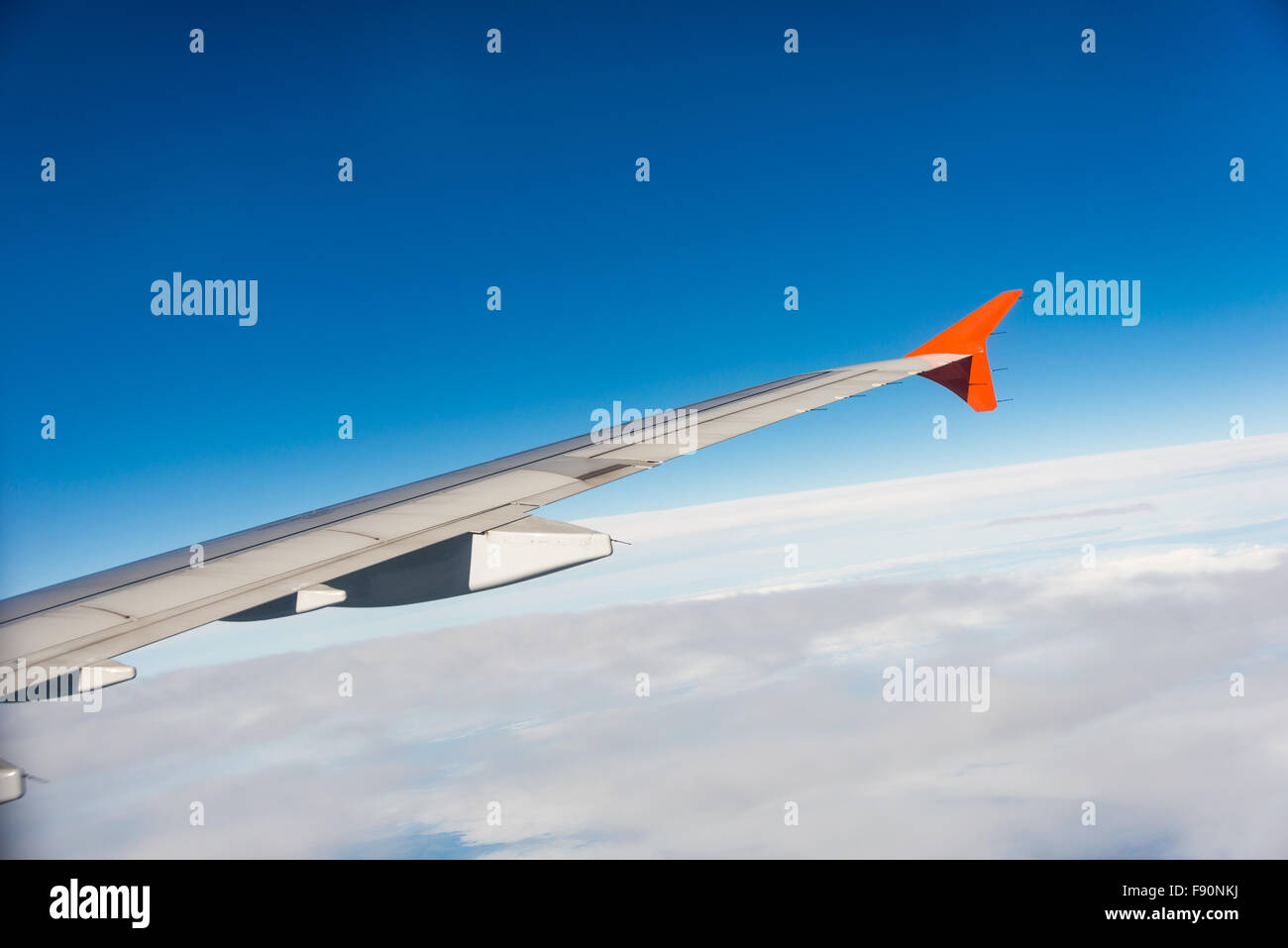 Airplane wing out of window Stock Photo - Alamy