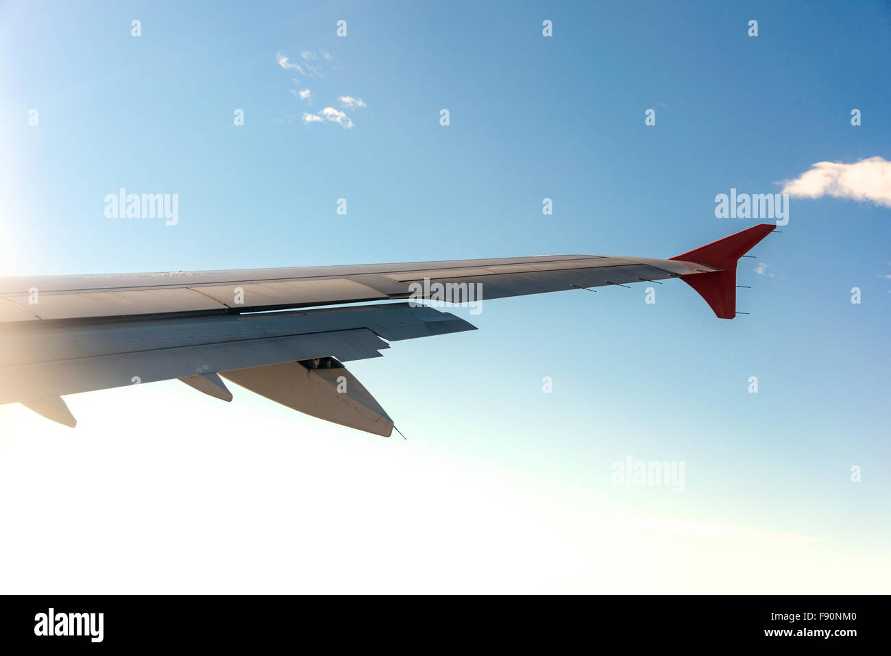 Airplane wing out of window Stock Photo - Alamy