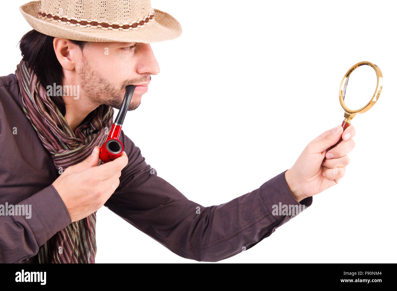 Young detective with pipe and magnifying glass Stock Photo - Alamy