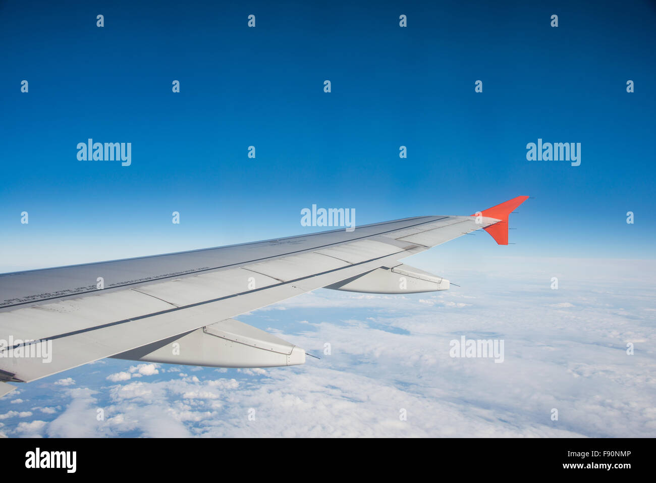Airplane wing out of window Stock Photo - Alamy
