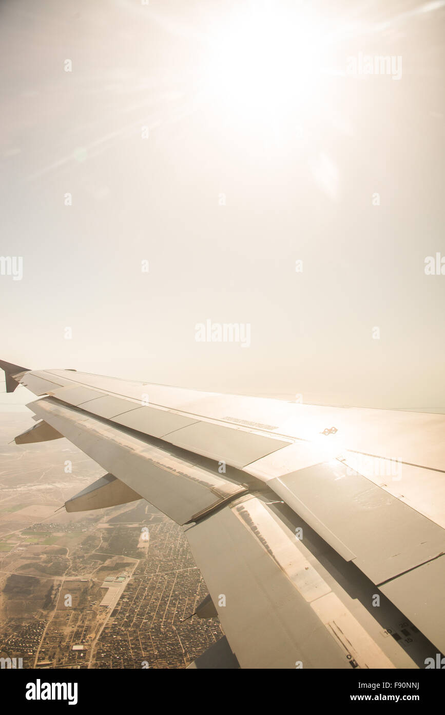 Airplane wing out of window Stock Photo - Alamy
