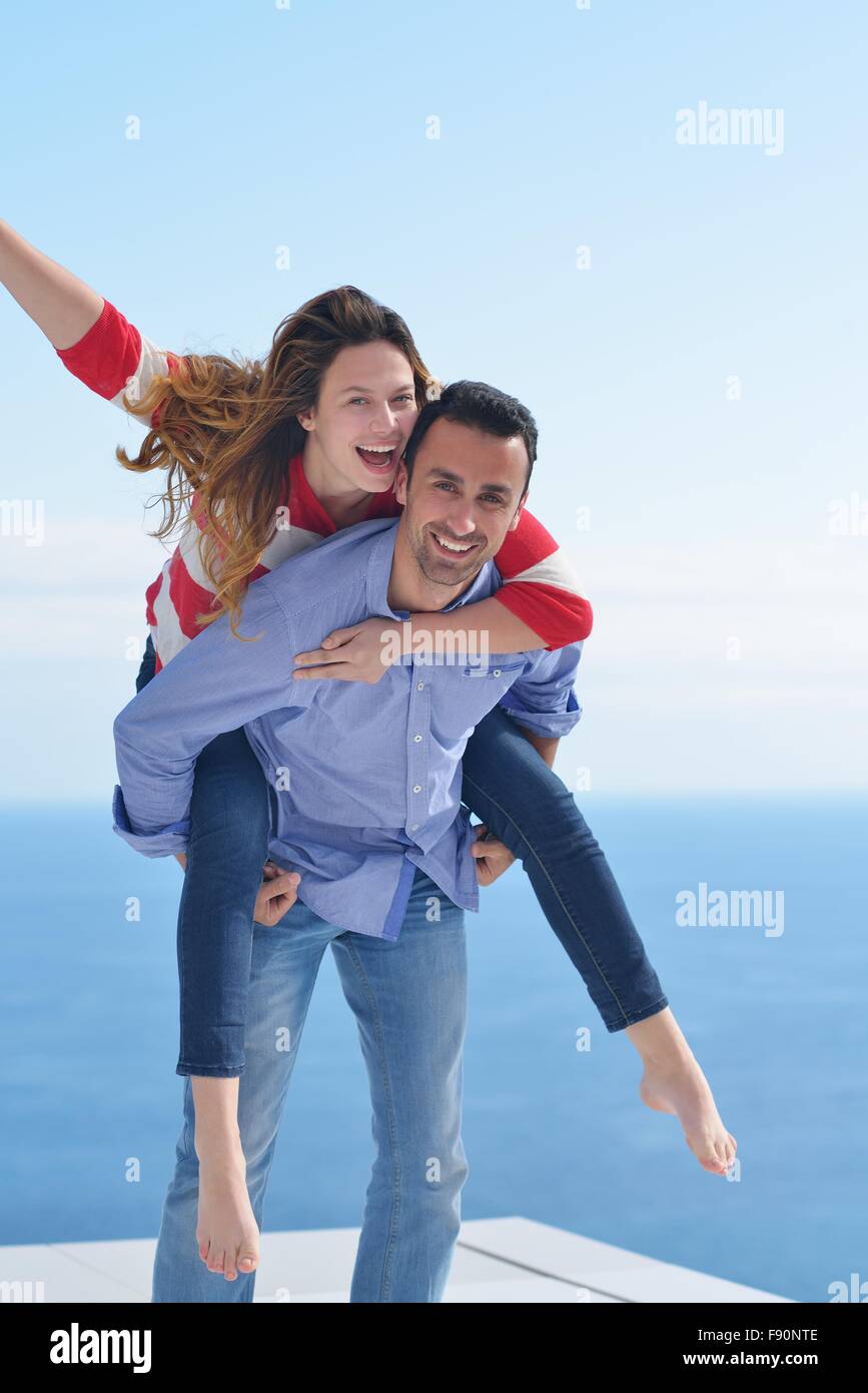 happy young romantic couple have fun relax smile at modern home indoor ...