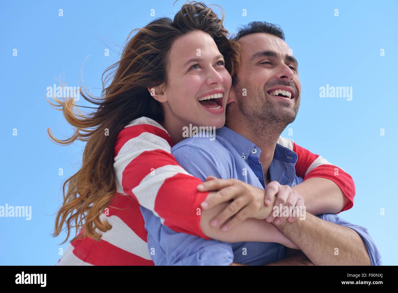 happy young romantic couple have fun relax smile at modern home indoor ...