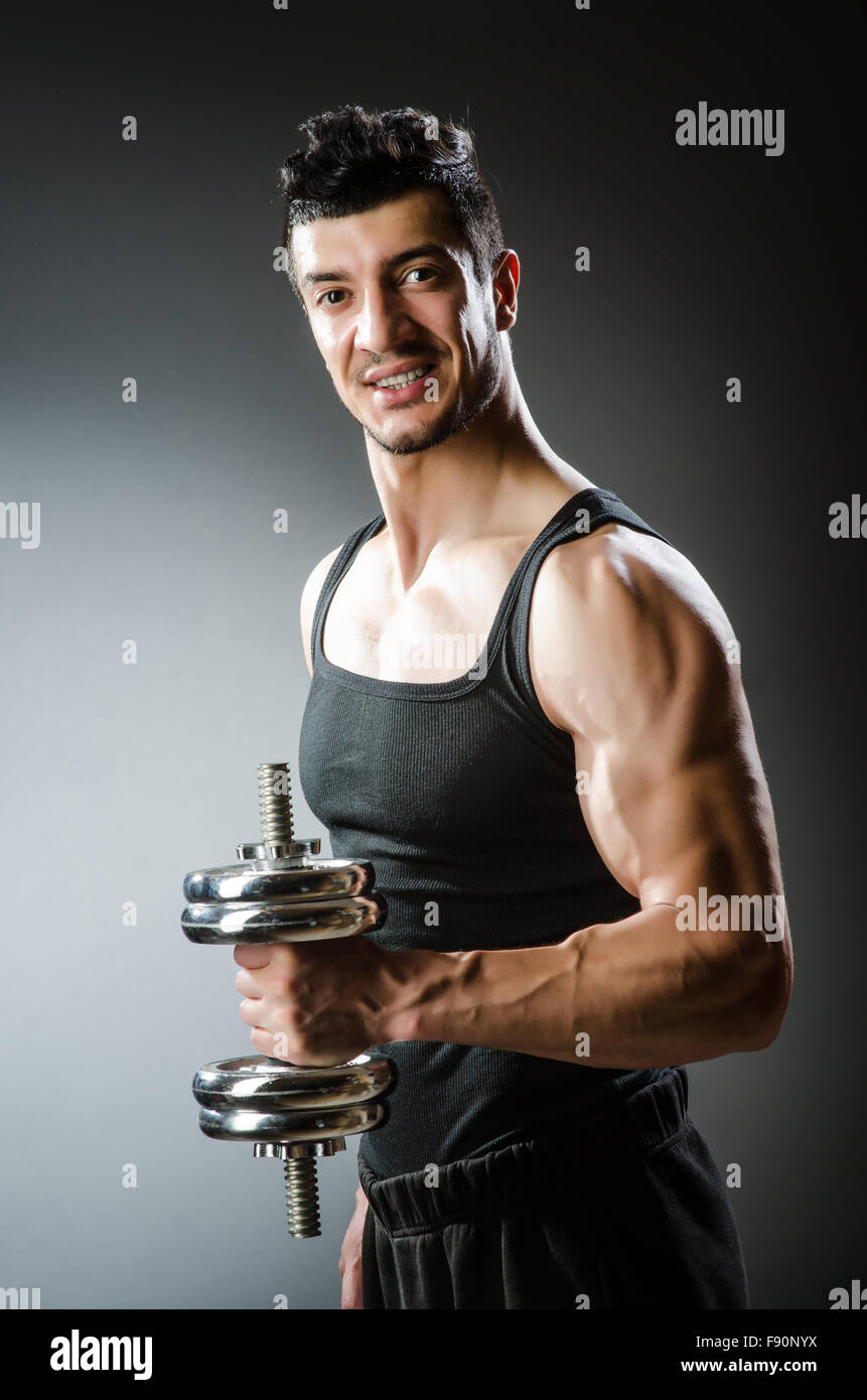 Muscular ripped bodybuilder with dumbbells Stock Photo - Alamy