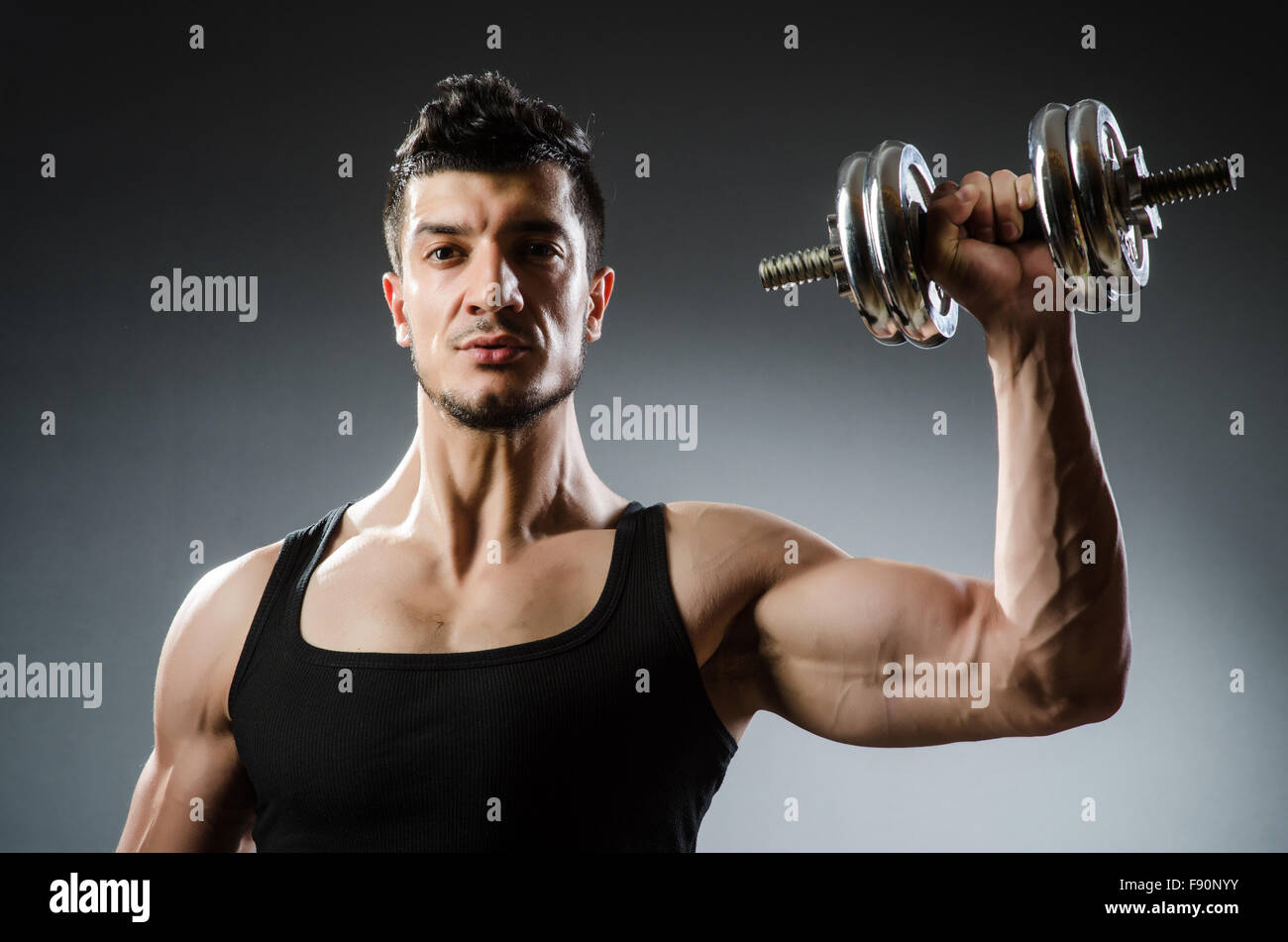 Muscular ripped bodybuilder with dumbbells Stock Photo - Alamy