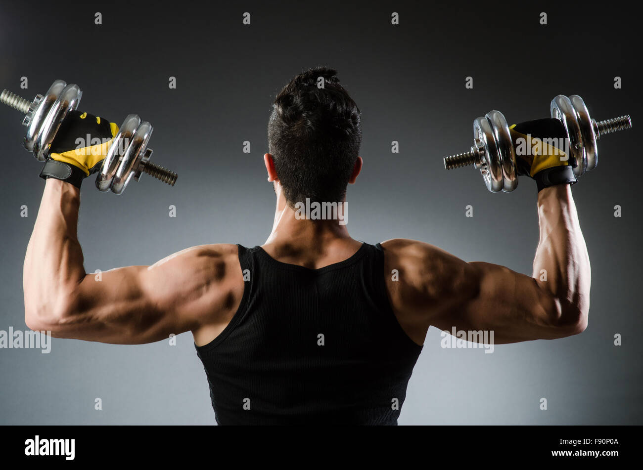 Muscular ripped bodybuilder with dumbbells Stock Photo - Alamy