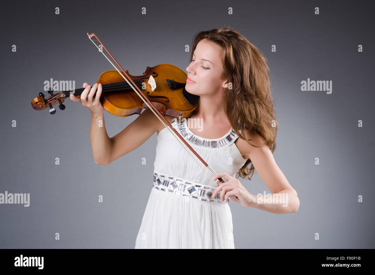 Woman artist with violin in music concept Stock Photo - Alamy