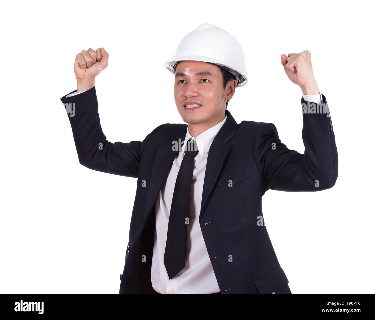 Happy young engineer celebrating with arm raised, concept of successful ...