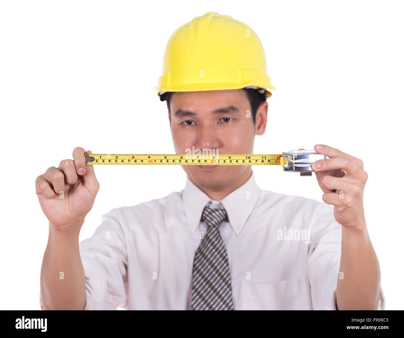 engineer in a helmet with a tape measure isolated on white background ...