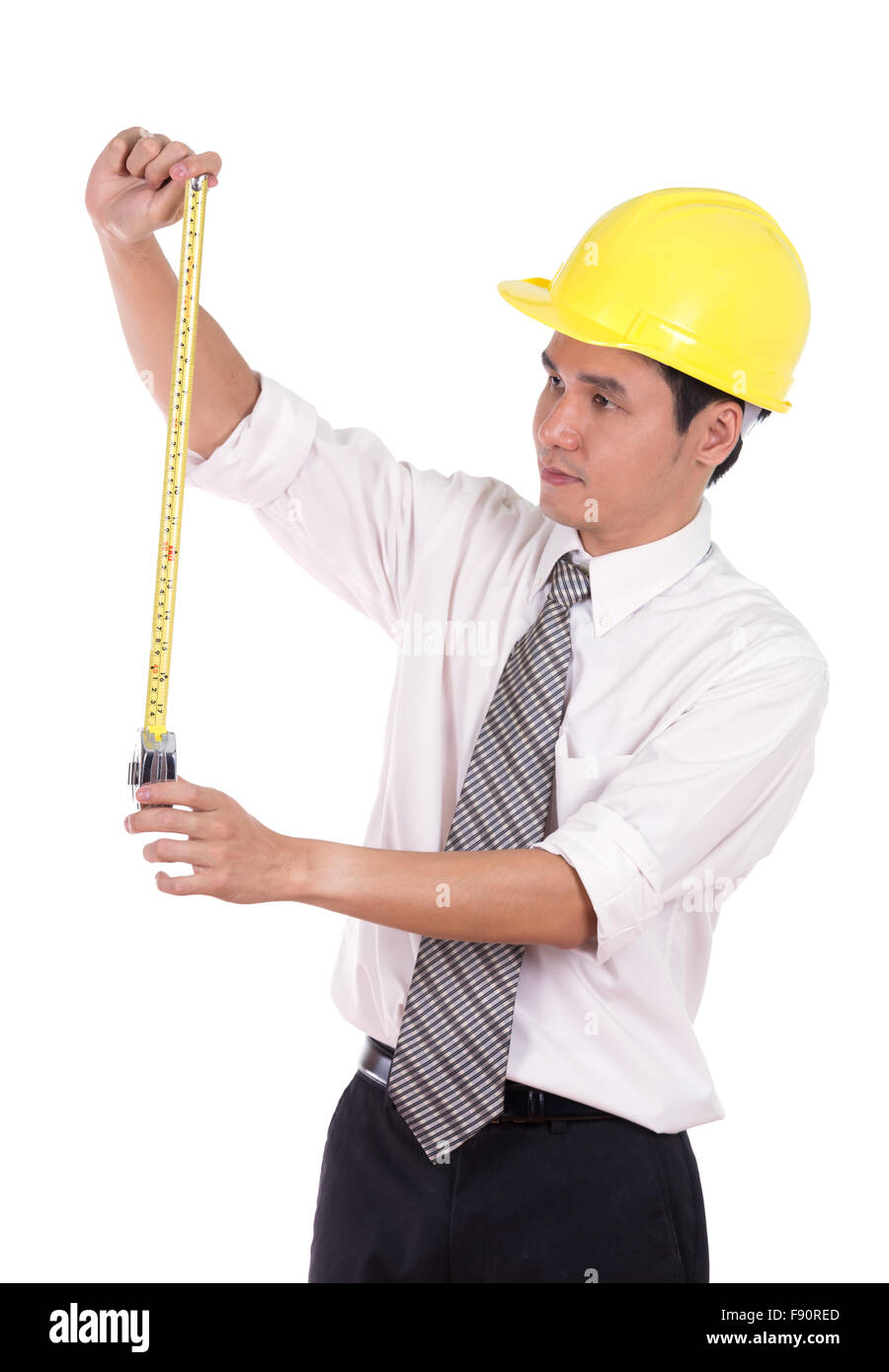 engineer in a helmet with a tape measure isolated on white background ...