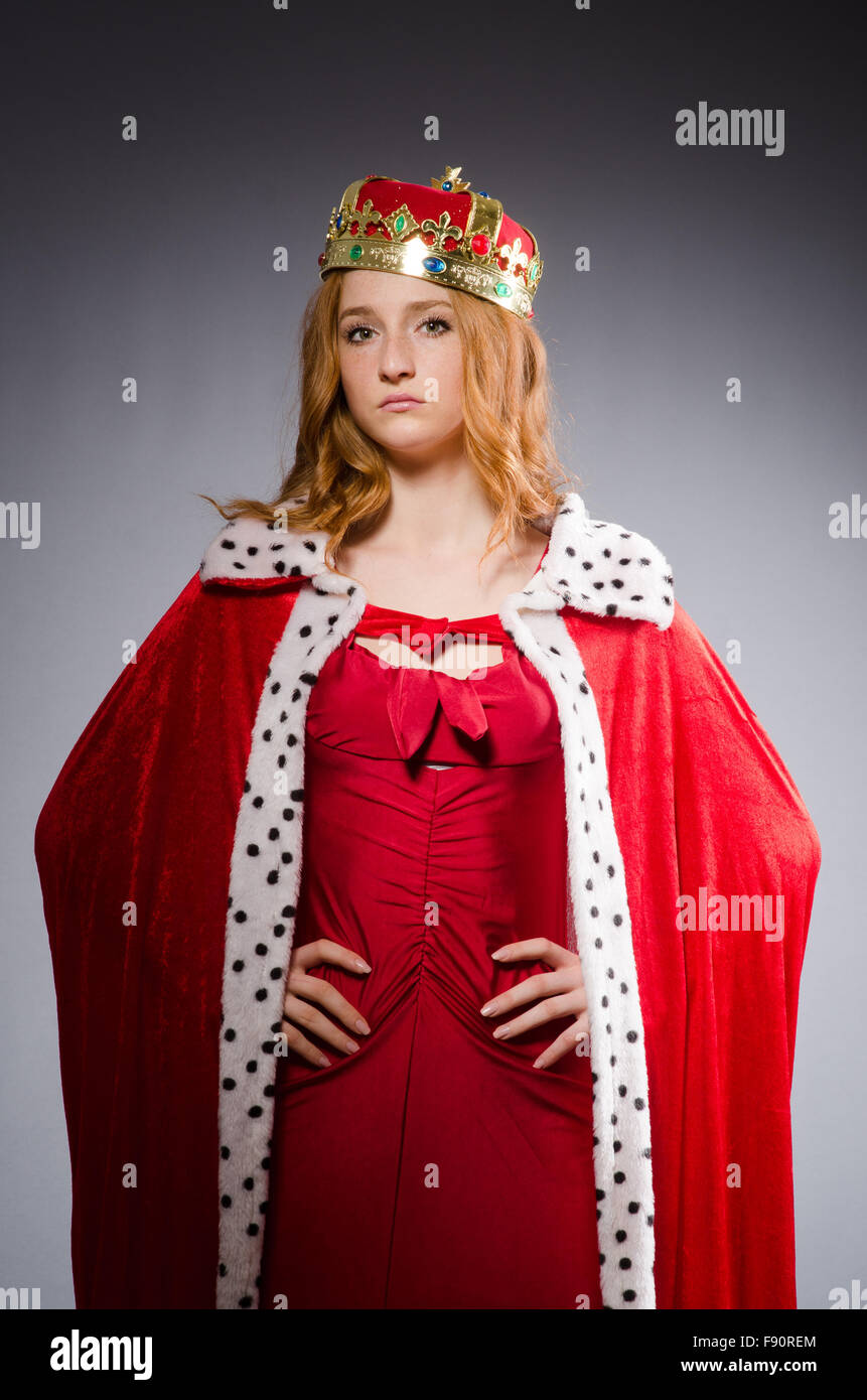 Queen in red dress in studio Stock Photo - Alamy