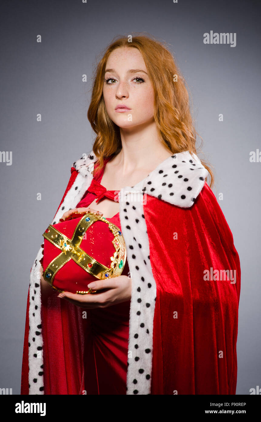 Queen in red dress in studio Stock Photo - Alamy