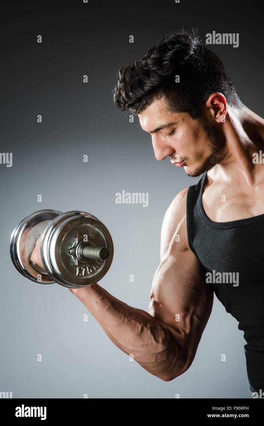 Muscular ripped bodybuilder with dumbbells Stock Photo - Alamy