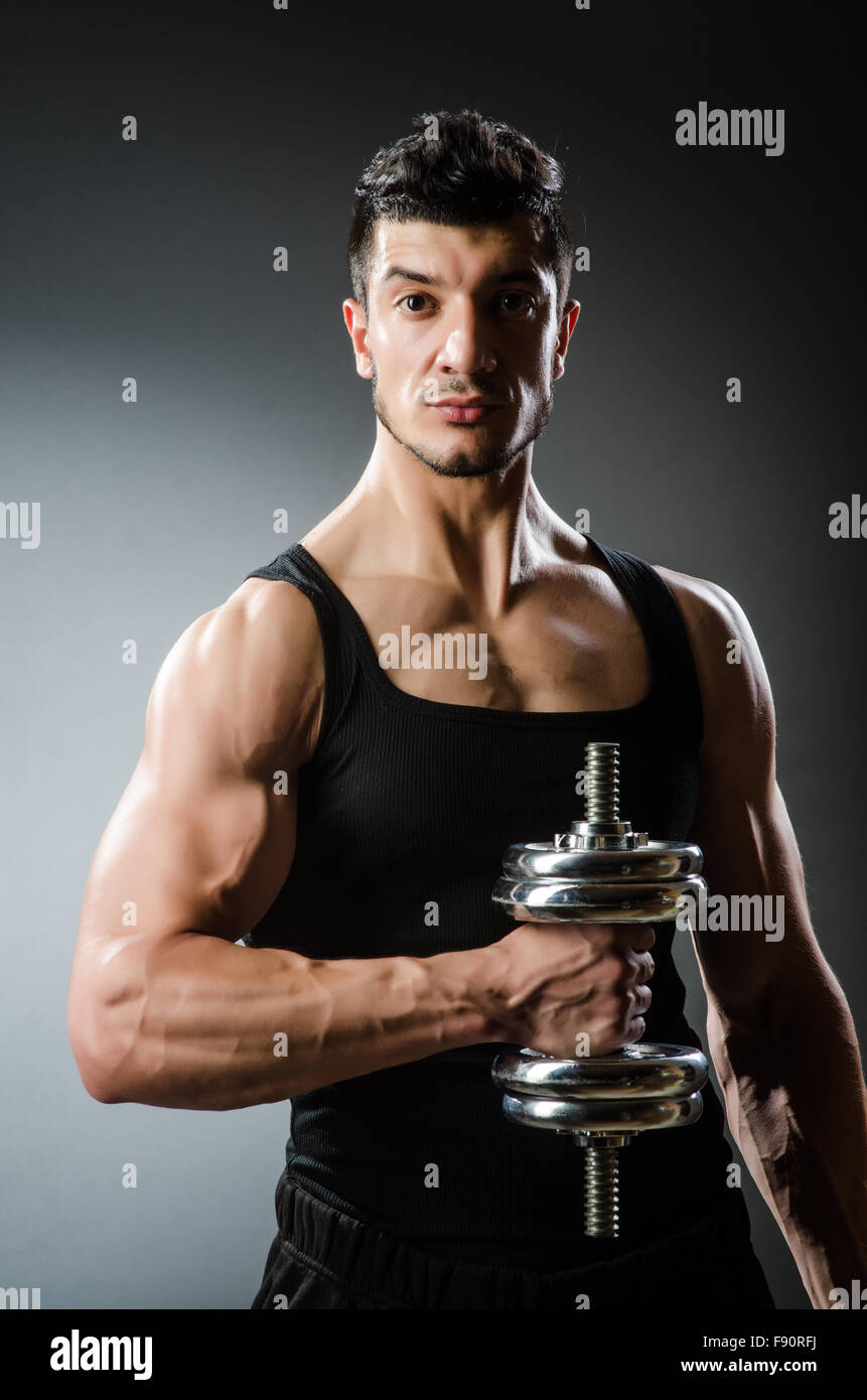 Muscular ripped bodybuilder with dumbbells Stock Photo - Alamy