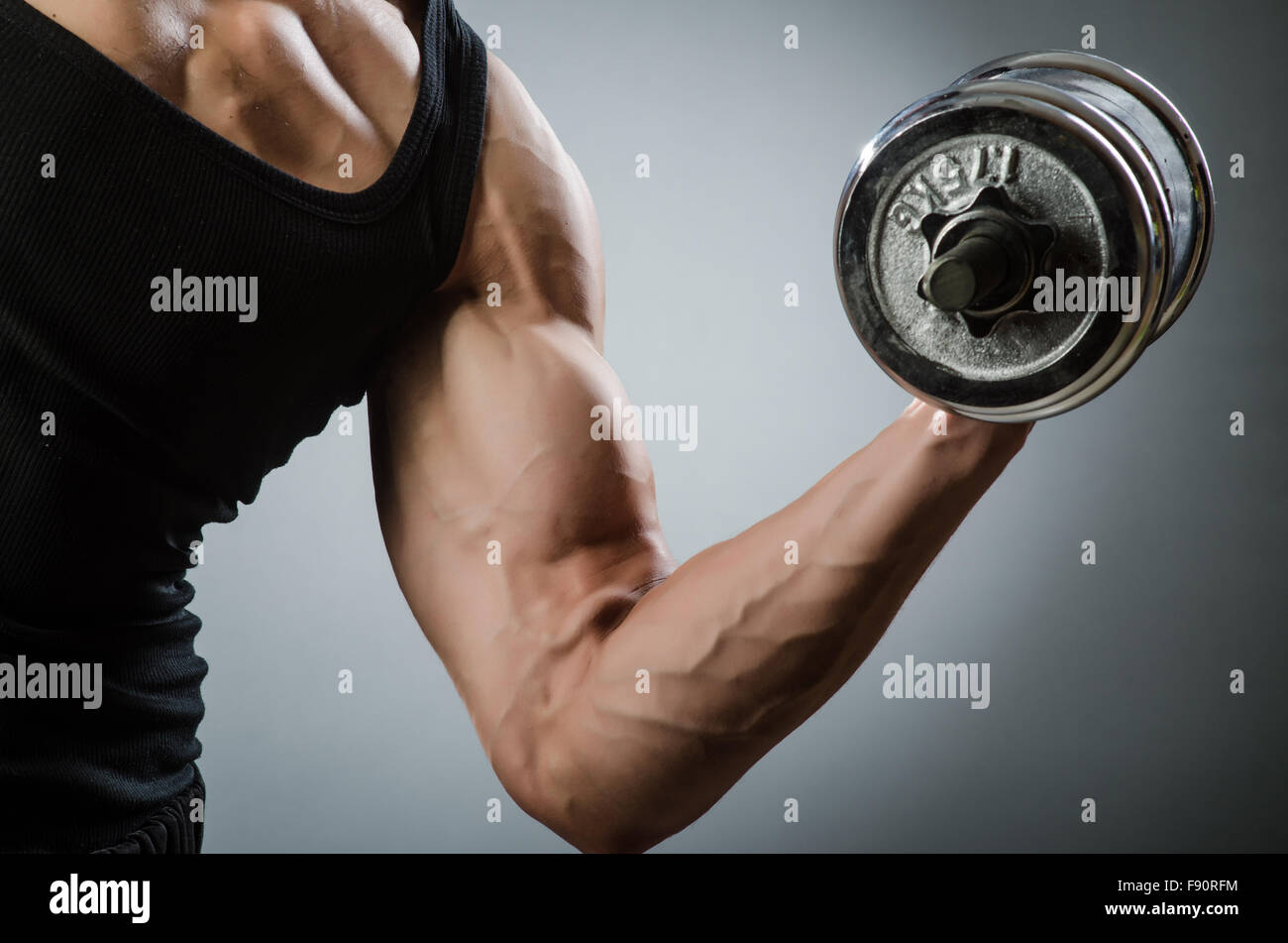 Muscular ripped bodybuilder with dumbbells Stock Photo - Alamy