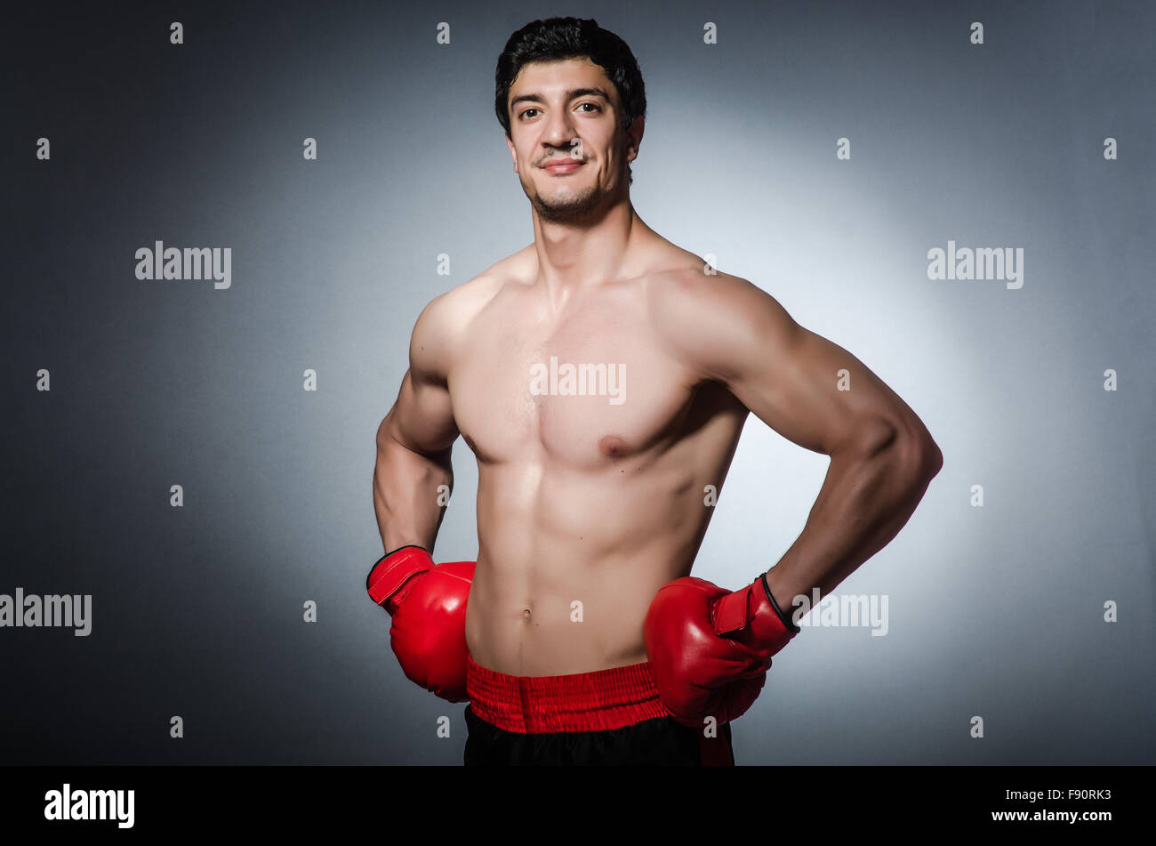 Muscular boxer wiith red gloves Stock Photo - Alamy