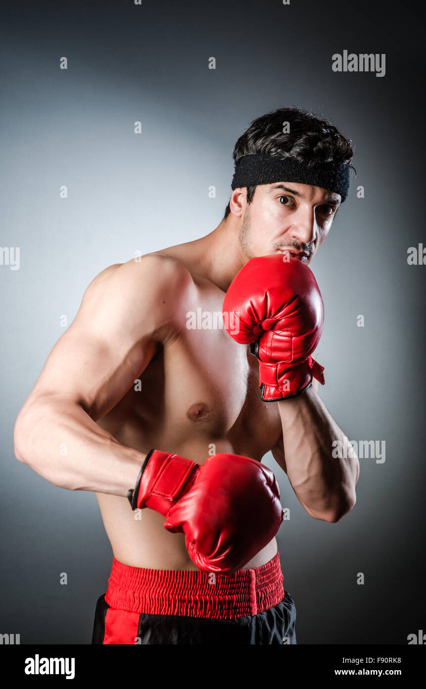 Muscular boxer wiith red gloves Stock Photo - Alamy