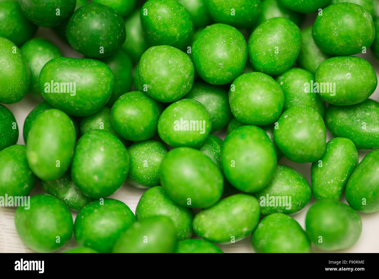 Green sweets as a background Stock Photo - Alamy
