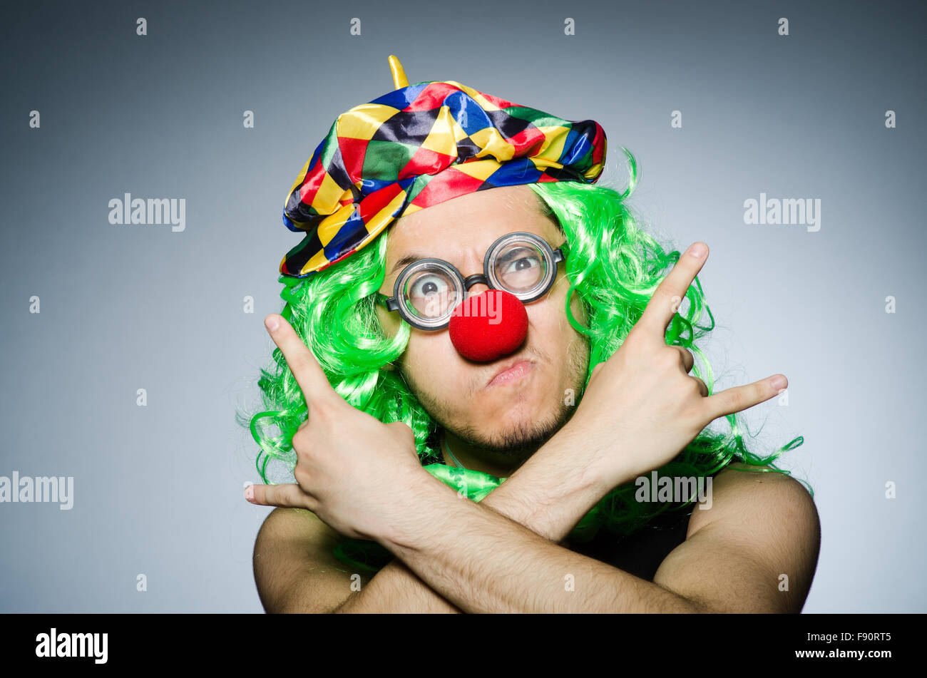 Funny clown against the dark background Stock Photo - Alamy