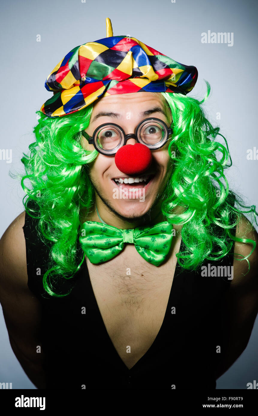 Funny clown against the dark background Stock Photo - Alamy