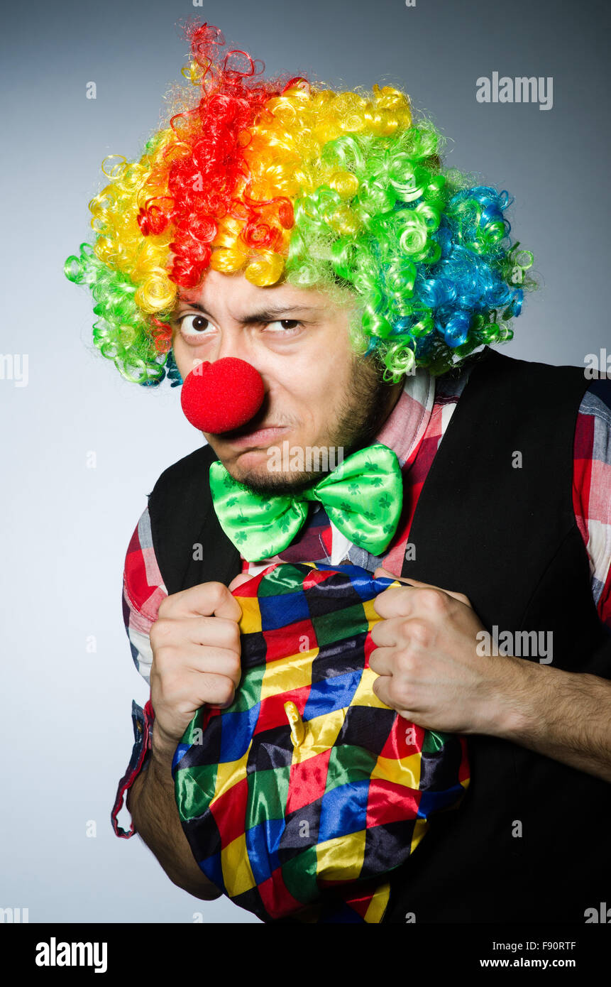 Funny clown against the dark background Stock Photo - Alamy