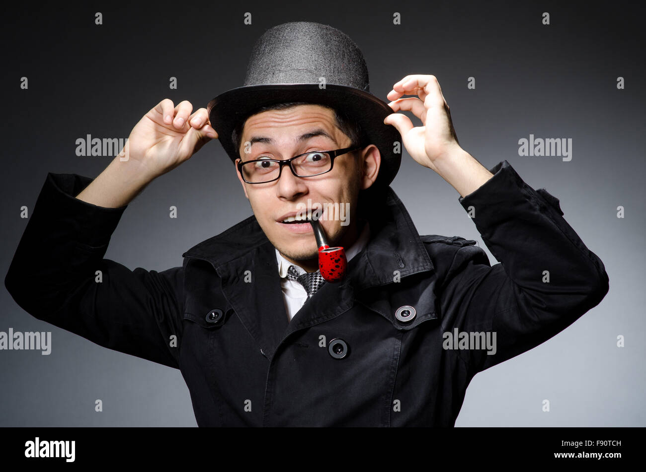 Funny detective with pipe and hat Stock Photo - Alamy