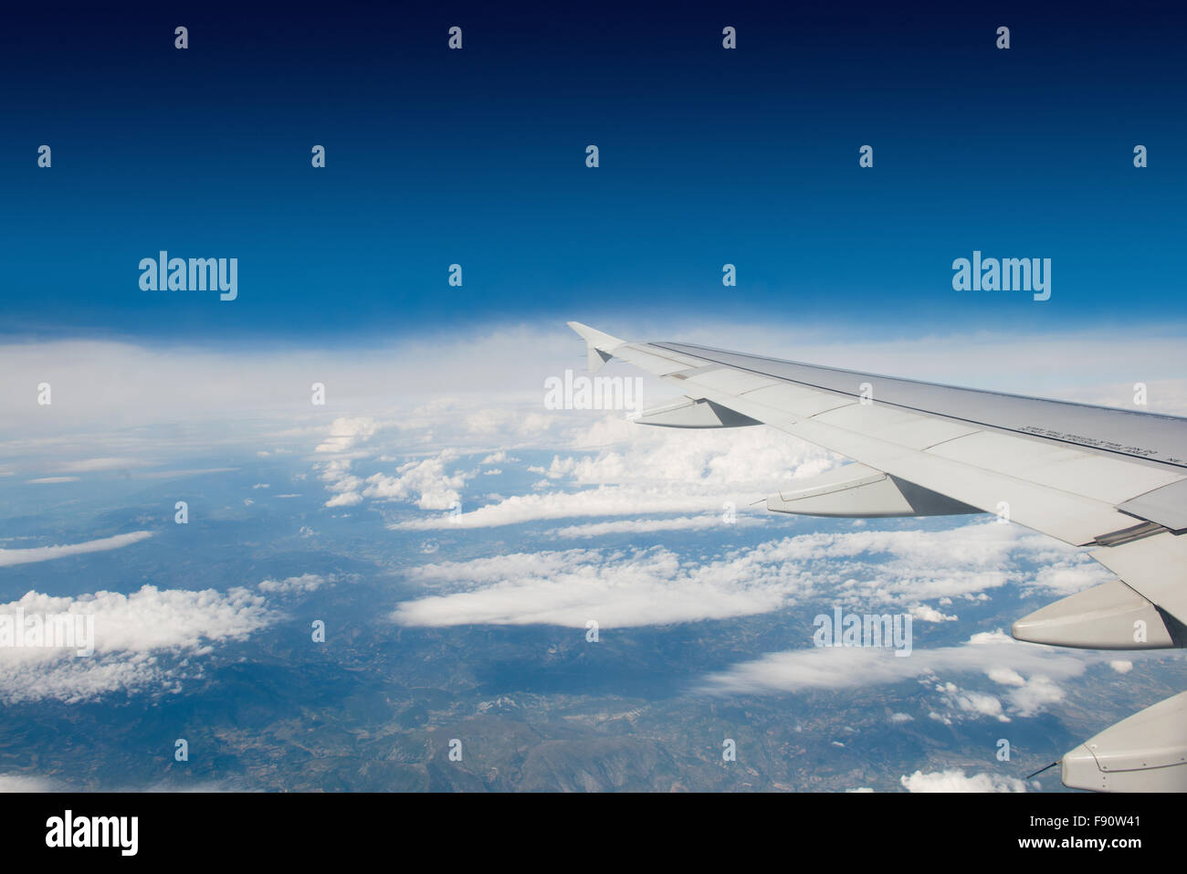 Airplane wing out of window Stock Photo - Alamy
