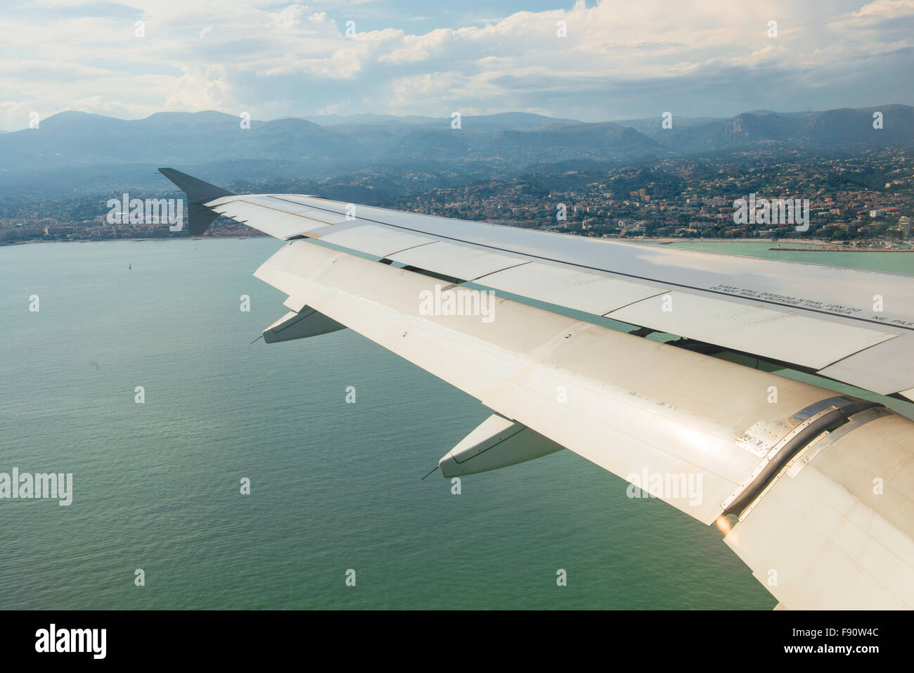 Airplane wing out of window Stock Photo - Alamy