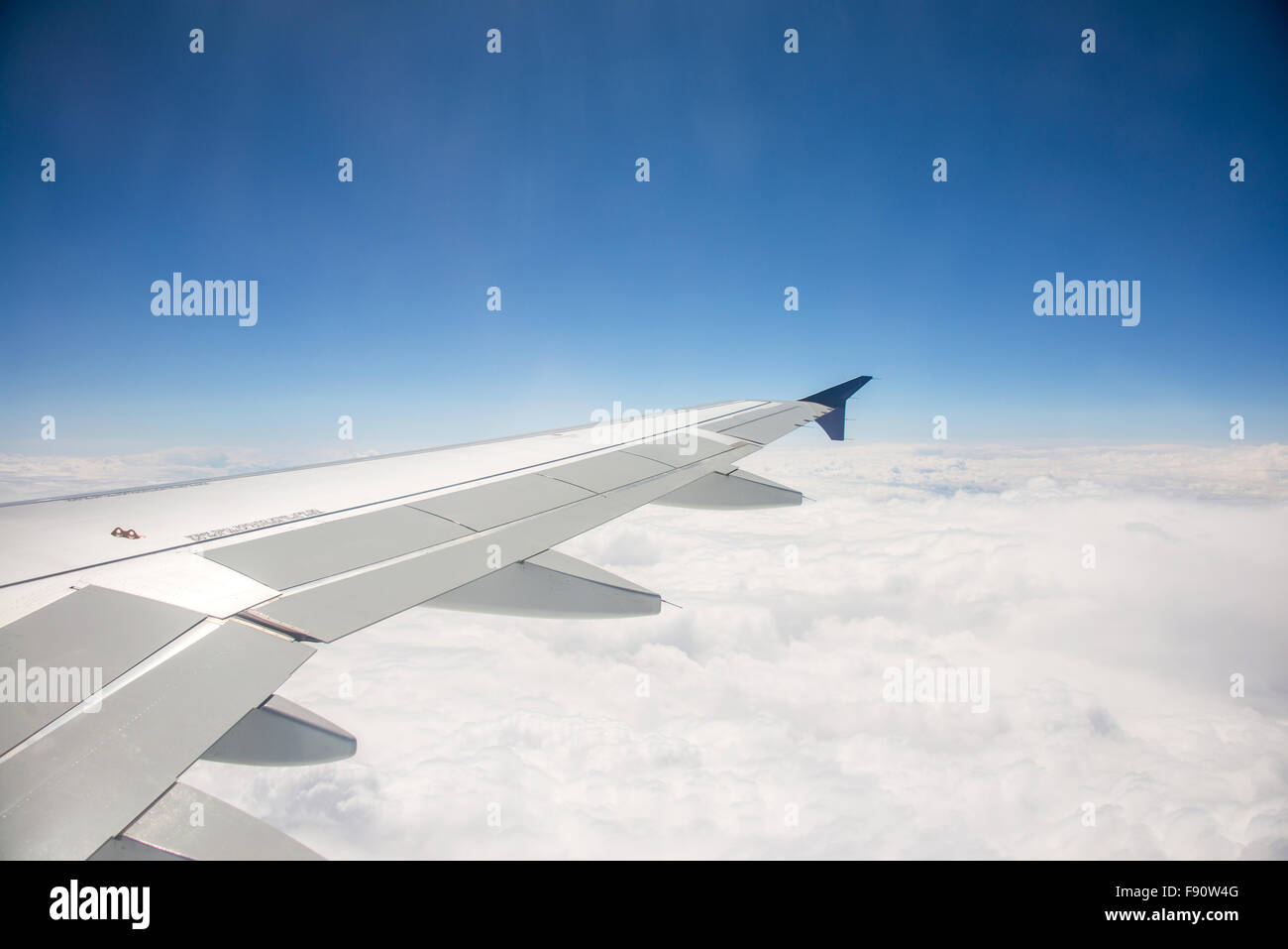 Airplane wing out of window Stock Photo - Alamy