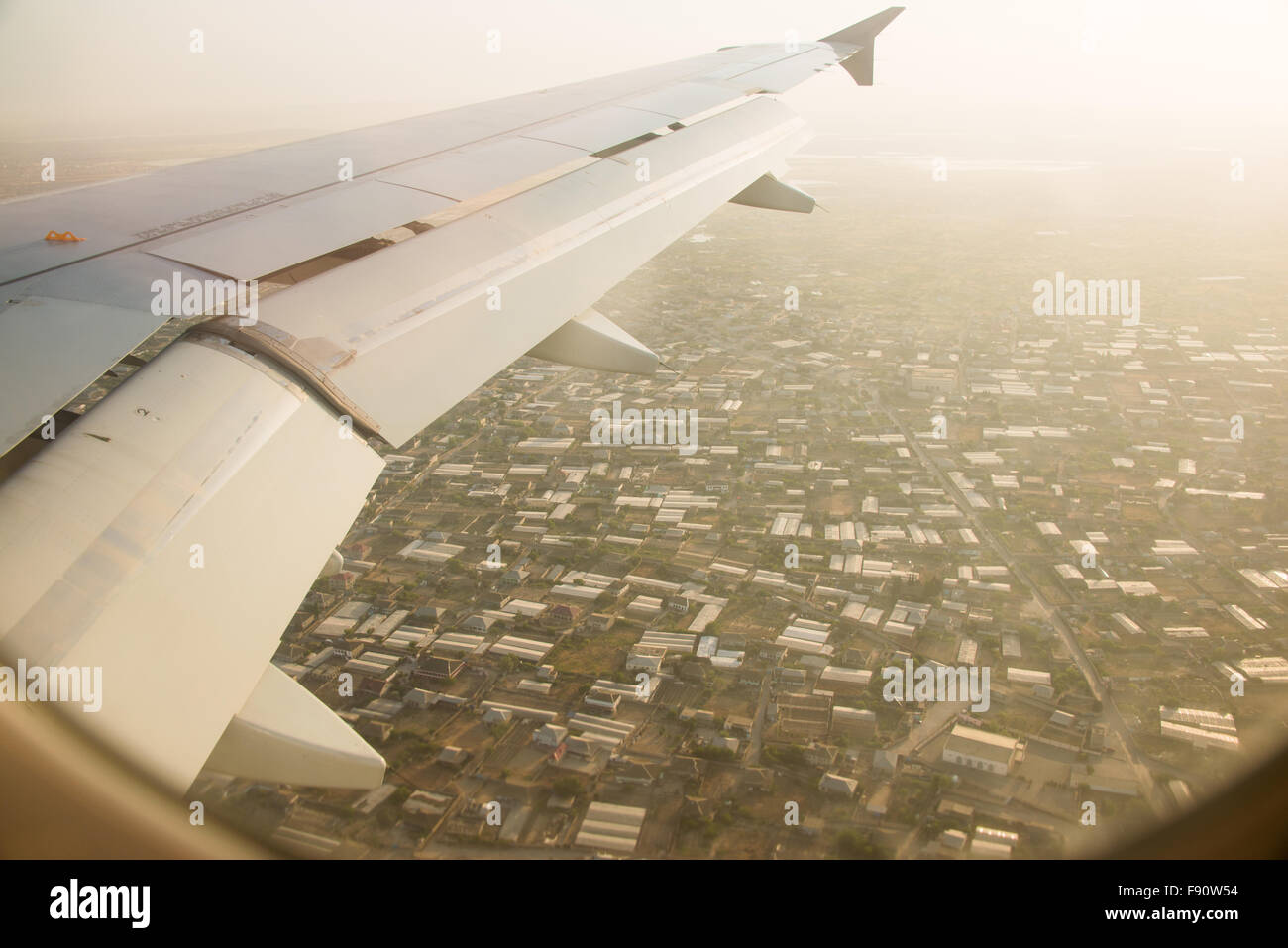 Airplane wing out of window Stock Photo - Alamy