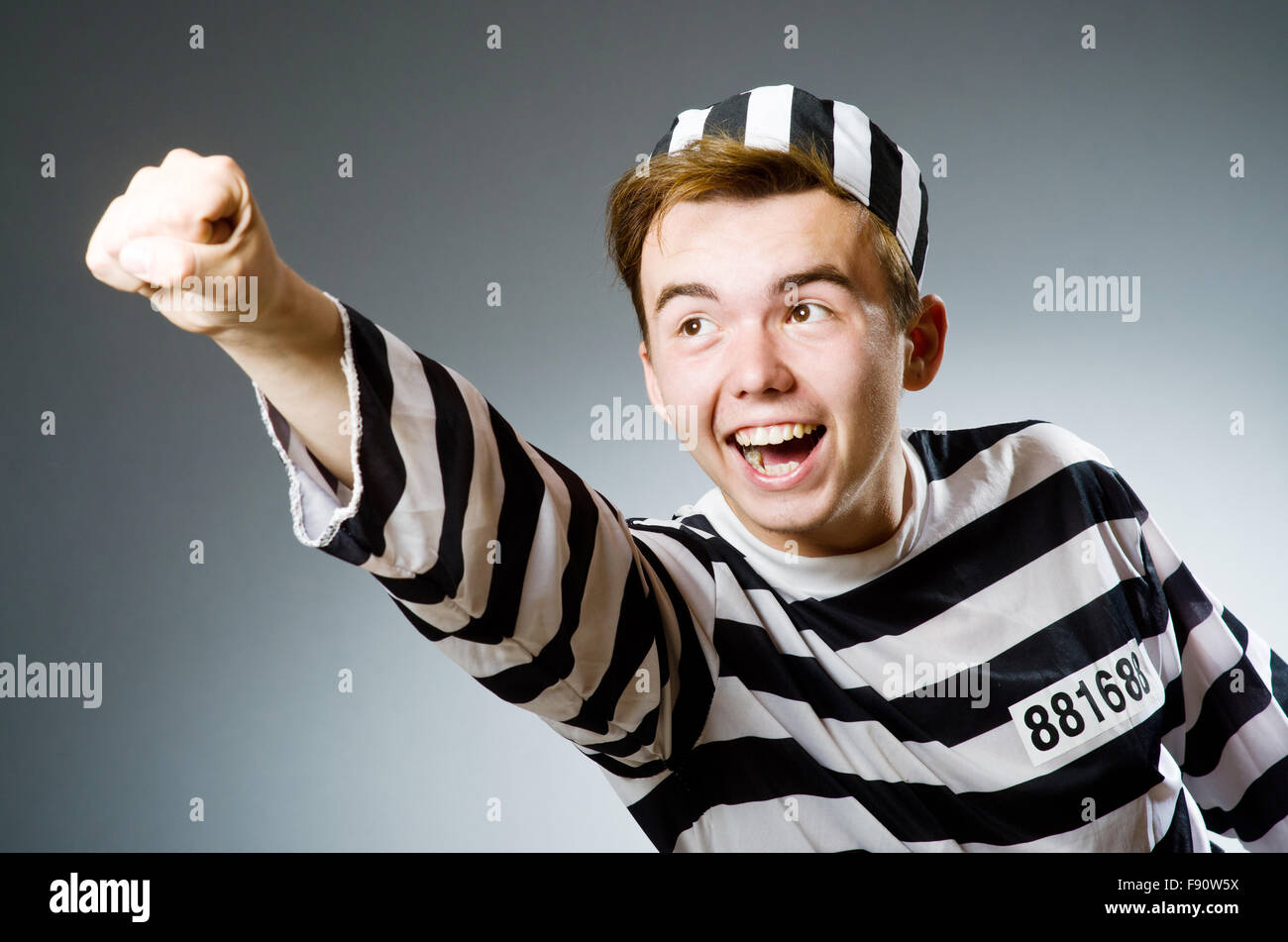 Funny prison inmate in concept Stock Photo - Alamy