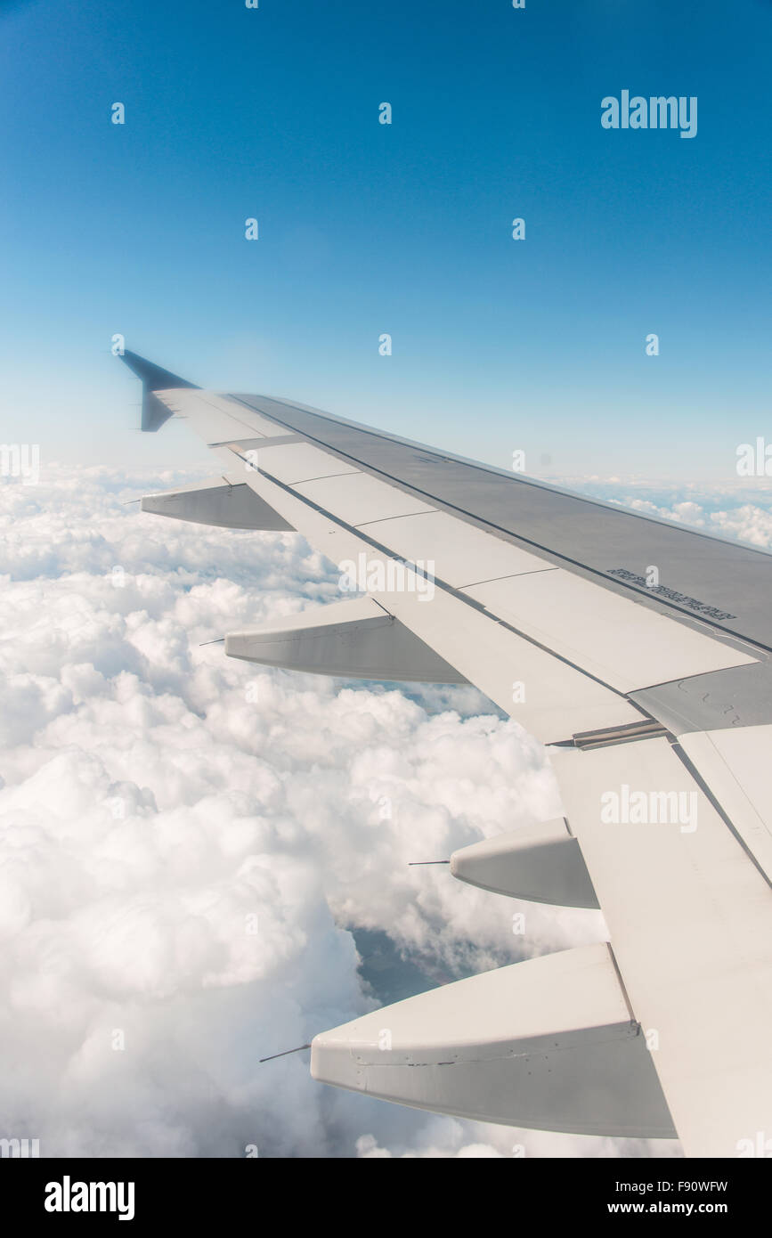 Airplane wing out of window Stock Photo - Alamy
