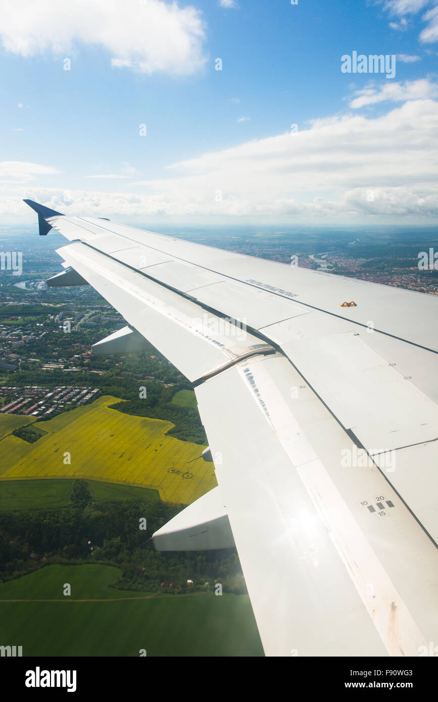Airplane wing out of window Stock Photo - Alamy
