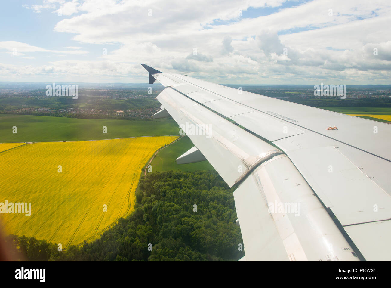 Airplane wing out of window Stock Photo - Alamy