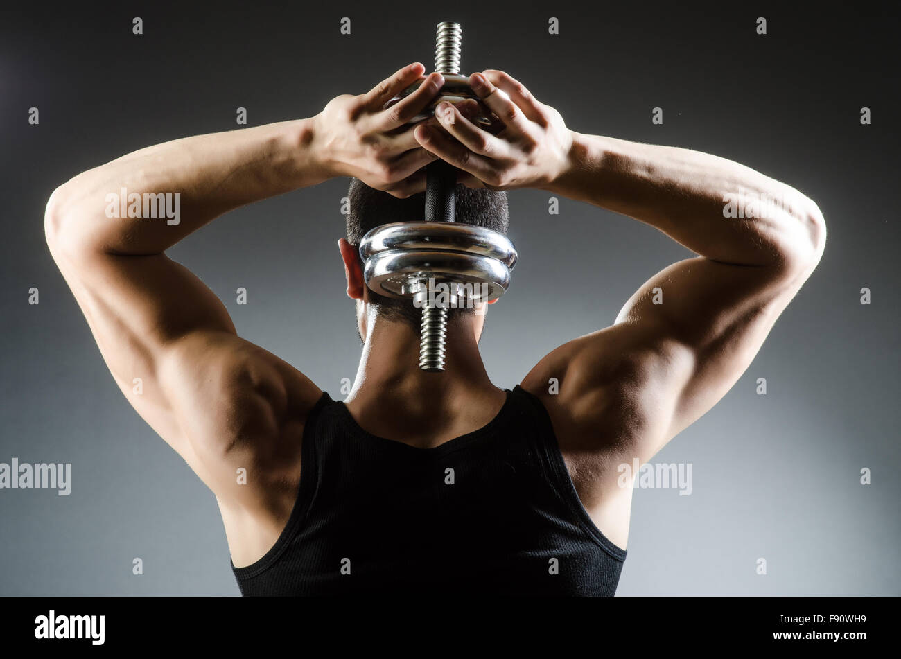 Muscular ripped bodybuilder with dumbbells Stock Photo - Alamy
