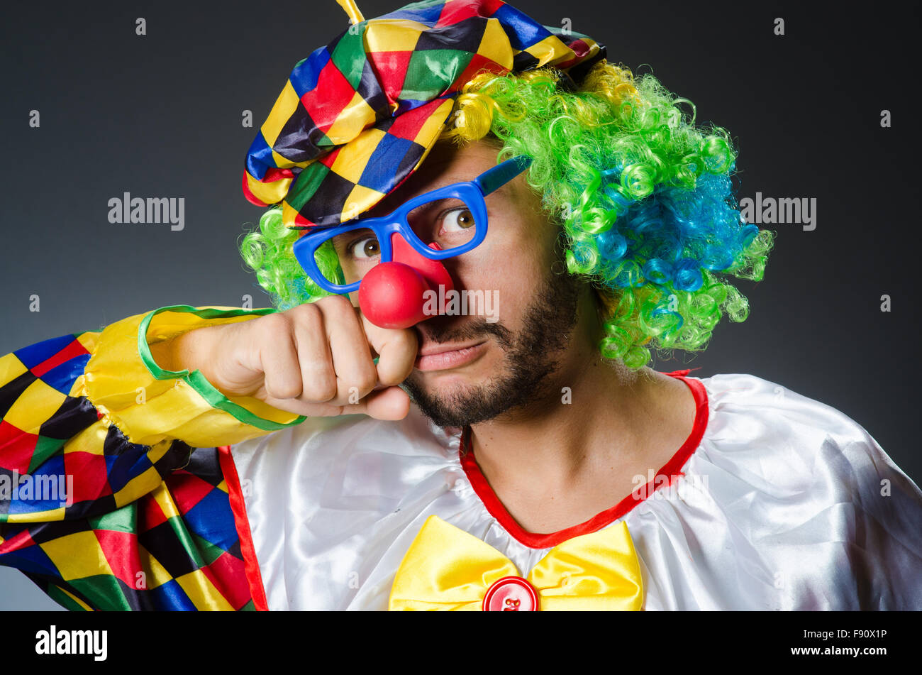 Funny clown in colourful costume Stock Photo - Alamy