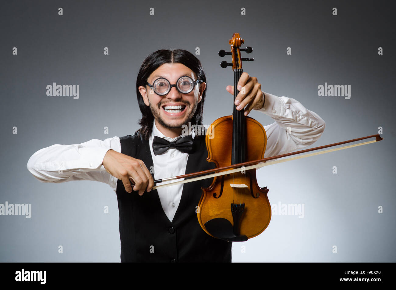 Funny fiddle violin player in musical concept Stock Photo - Alamy