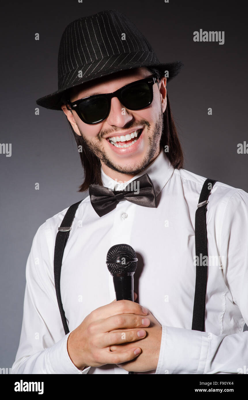 Funny singer with microphone at the concert Stock Photo - Alamy